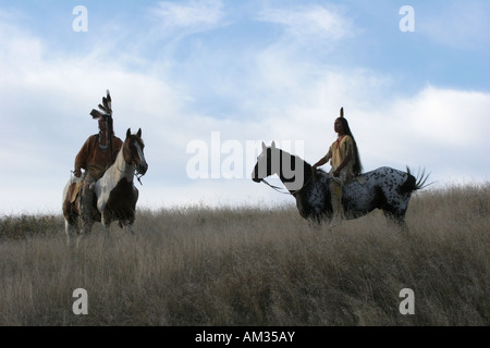 Two Native American Indian men on horseback scouting for enemies or ...