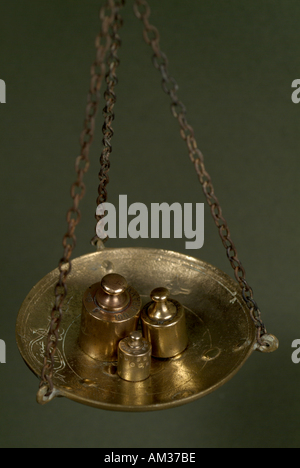 French copper weights on a scale Stock Photo - Alamy