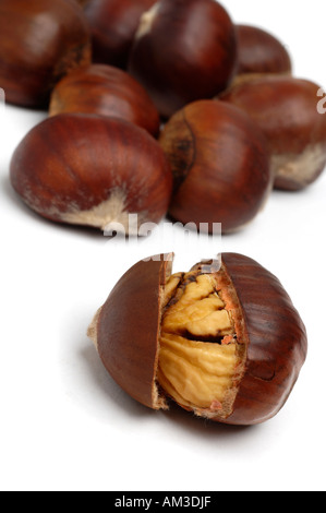 Sweet chestnuts on white background Stock Photo - Alamy