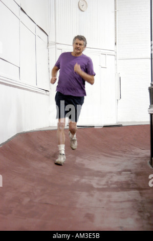a older man is running on a track in the park, a running man, running ...