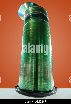 Very tall stack of CDs on a spindle Stock Photo - Alamy