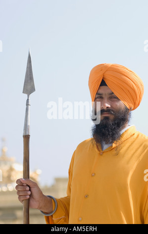 Portrait of a Sikh guard holding a spear, Golden Temple, Amritsar ...