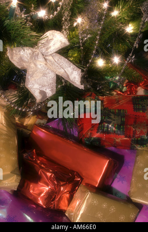 Christmas decorations and ornaments under a Christmas tree around the ...