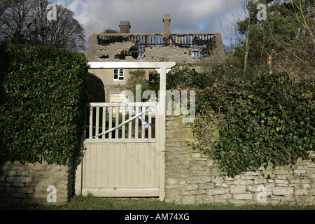 Burnt out Manor House in the cotswold village of Hampnett one man died ...