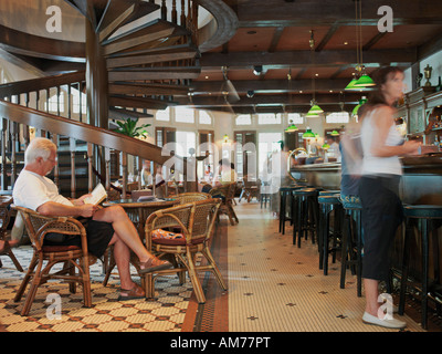 The long bar in the famous Raffles Hotel in Singapore where the ...