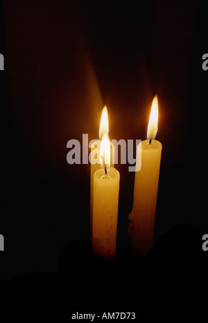 Lit candles in the dark with a copy of space. concept of magic ...