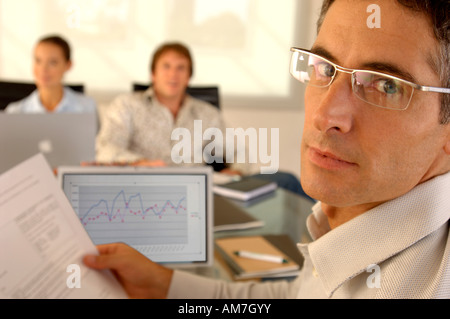 Businessman holding pen document graph accounting finance paper work ...