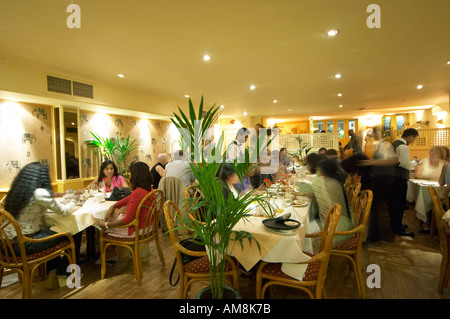 Diners and waiters in Haandi Indian Restaurant London SW3 Stock Photo ...