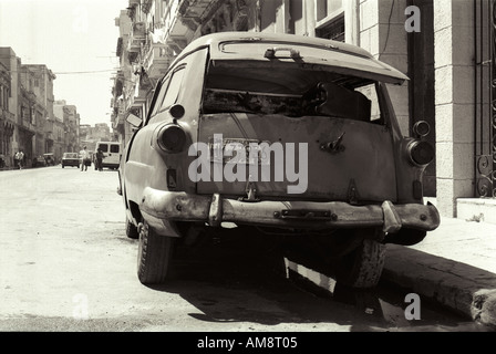 Old battered rusty Chevrolet car Scene in a street in old Havanna near ...
