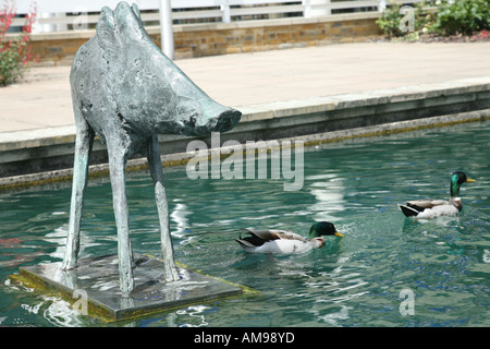 A statue in Harlow town center shopping at the water gardens Stock ...