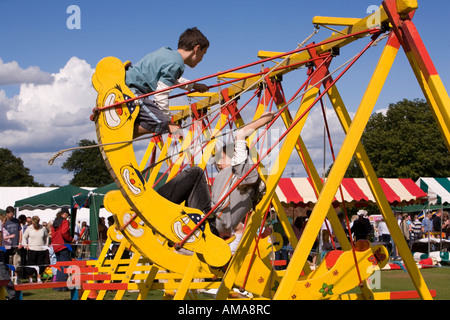 children on a traditional swing boat ride Stock Photo - Alamy
