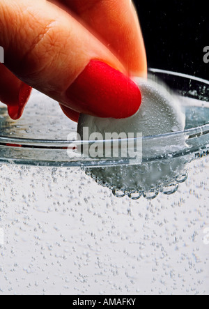 glass water with water being dropped in the glass, water in movement ...