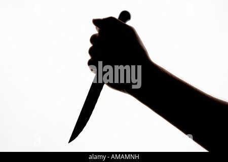 Silhouette of a Hand Holding a Knife Stock Photo - Alamy