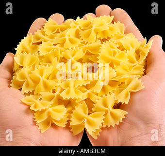 HANDFUL OF FARFALLE PASTA Stock Photo - Alamy