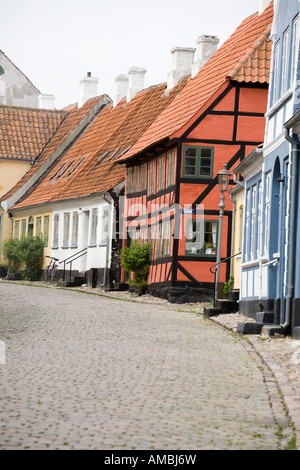Curved Aero Streetscape A curved cobblestone street lined brightly ...