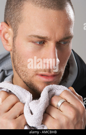 Close-up portrait of a brooding bearded man. Blue jacket in business ...