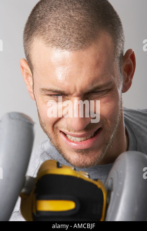 Caucasian weight lifter straining Stock Photo - Alamy