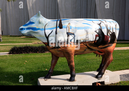Interactive public art exhibition of painted fibreglass cows in park ...