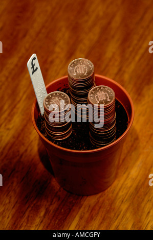 Pot with money Stock Photo - Alamy