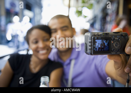 A couple pose for a photograph outside the Houses of Parliament in ...
