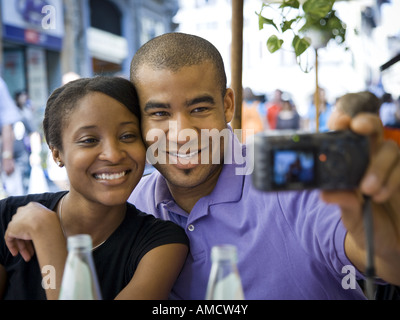 A couple pose for a photograph outside the Houses of Parliament in ...