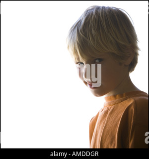 A vertical shot of a male making a funny face on a white background ...