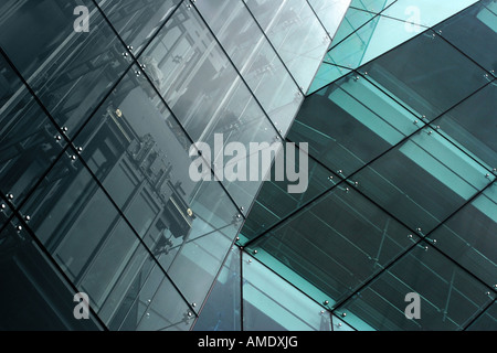 Architecture details. Modern glass building facade in sunny day ...