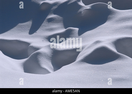 Winter scene with snow patterns on ground Stock Photo - Alamy
