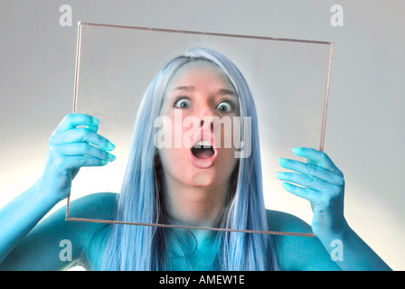 Young female with face smashed up against glass Stock Photo - Alamy
