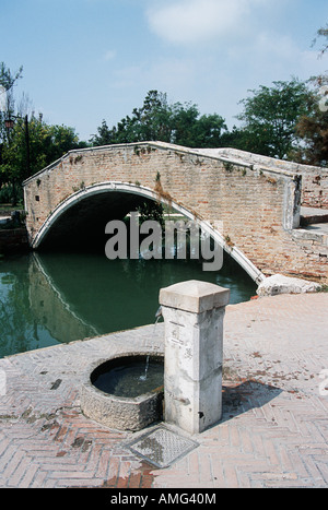 Bridge spanning over a canal to an island in a lake Stock Photo - Alamy