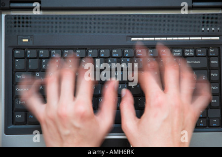 Blurred hands typing on computer keyboard Stock Photo - Alamy