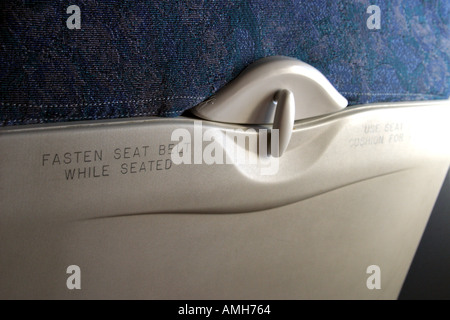 Airplane / plane seat tray table in the full down position and ready ...