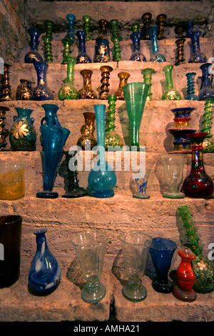 A display of objects made of glass of different colors Stock Photo - Alamy