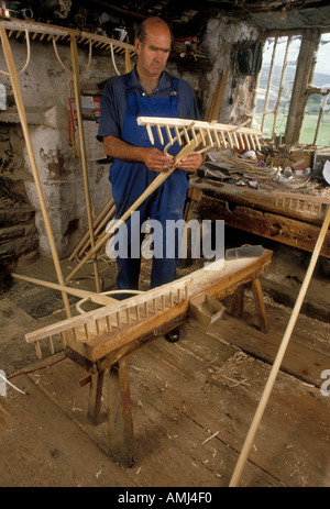 John Rudd making the traditional hay rake in his workshop bending part ...