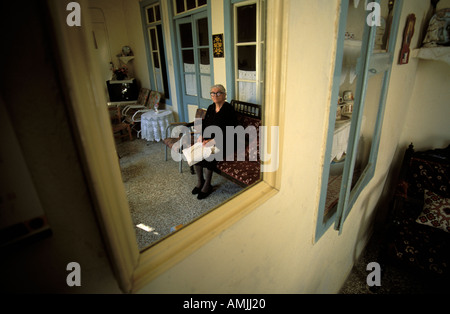 old greek cypriot widow woman grandmother drying black dresses outdoors ...