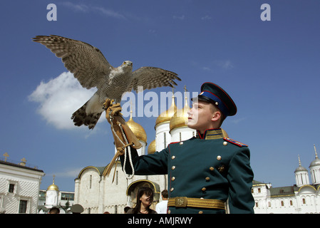 Soldier in the traditional uniform of the Tsar's Guard, with his falcon ...