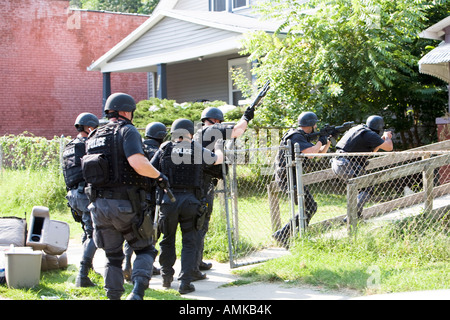 Police officers from tactical narcotics unit carrying out high risk ...