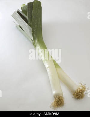 Cut and whole organic leek on grey table Stock Photo - Alamy