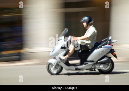Man riding moped in Nice France Stock Photo - Alamy