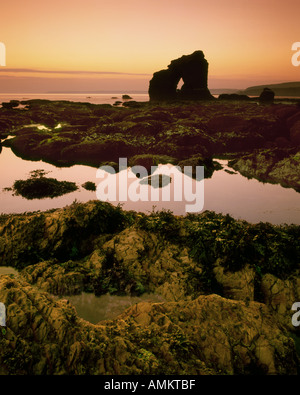 Thurlestone Beach, South Devon at sunrise with red sky and waves, tide ...