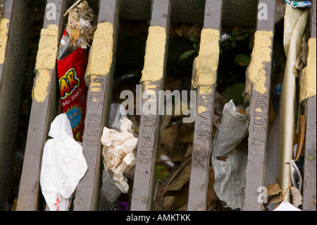rubbish thrown down a drain Stock Photo - Alamy