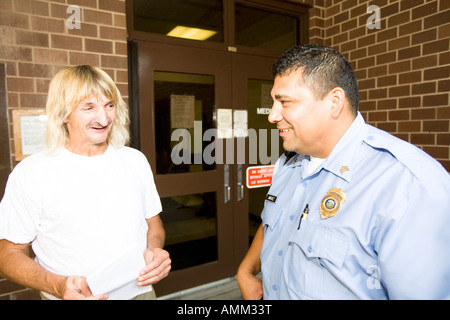 Correctional Officer talking to inmate Stock Photo - Alamy