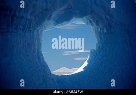 Weathered Iceberg with a circular window near Booth Island Stock Photo ...