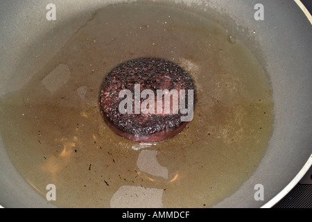 Black Pudding frying pig blood sausage Stock Photo - Alamy