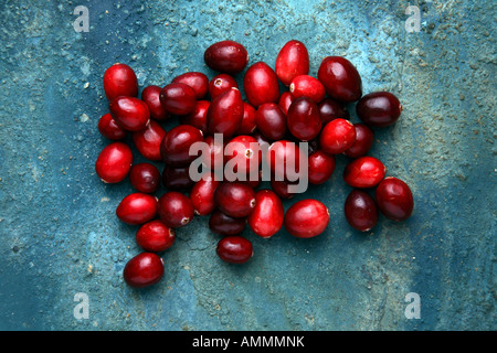 Cranberries on a rustic blue background Stock Photo - Alamy