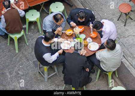Local Chinese Men Eating Lunch at an Outdoor Restaurant Table Hong Kong ...