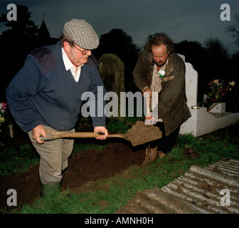 male cemetery worker digging a grave Stock Photo - Alamy