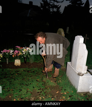 man digging a grave Stock Photo - Alamy
