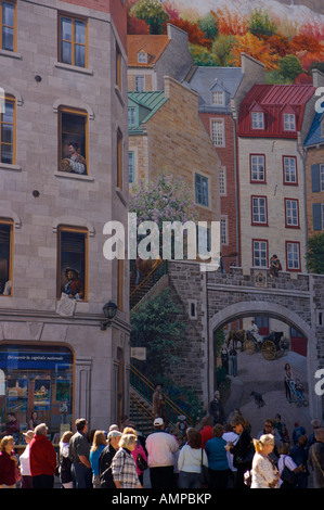La Fresque des Quebecois wall mural illuminated at night, Notre-Dame ...