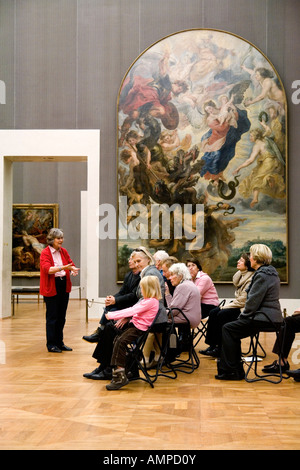 Visitors in front of the paintings by Flemish painter Peter Paul Rubens ...